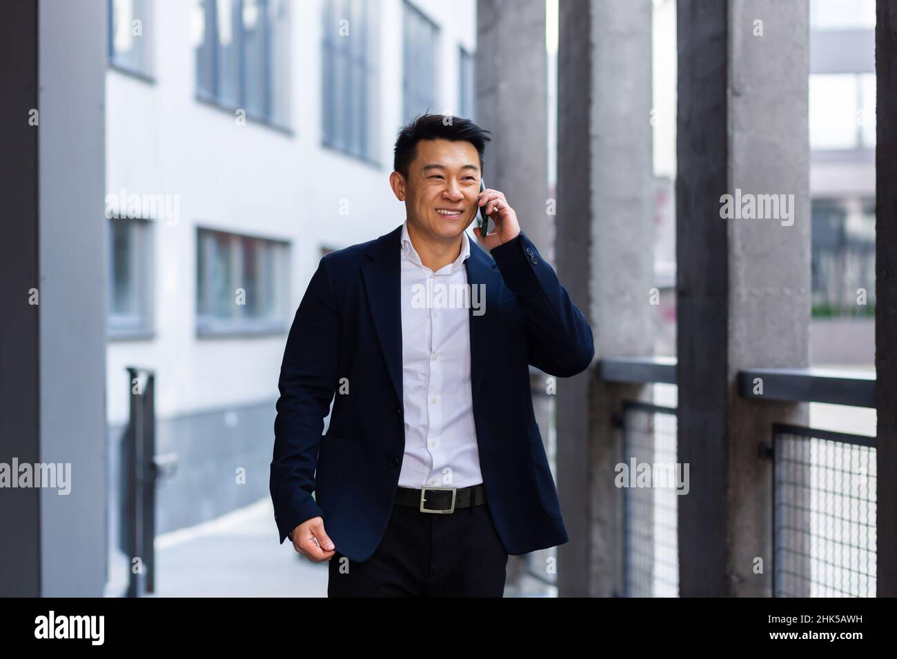 cheerful smiling Successful Asian businessman explains information to ...