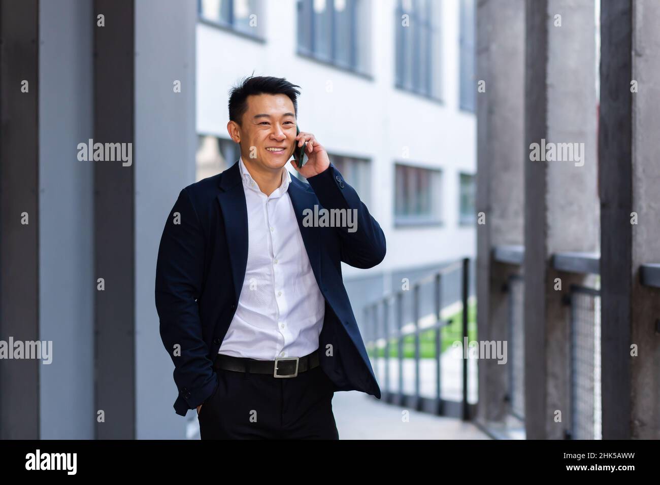 cheerful smiling Successful Asian businessman explains information to ...