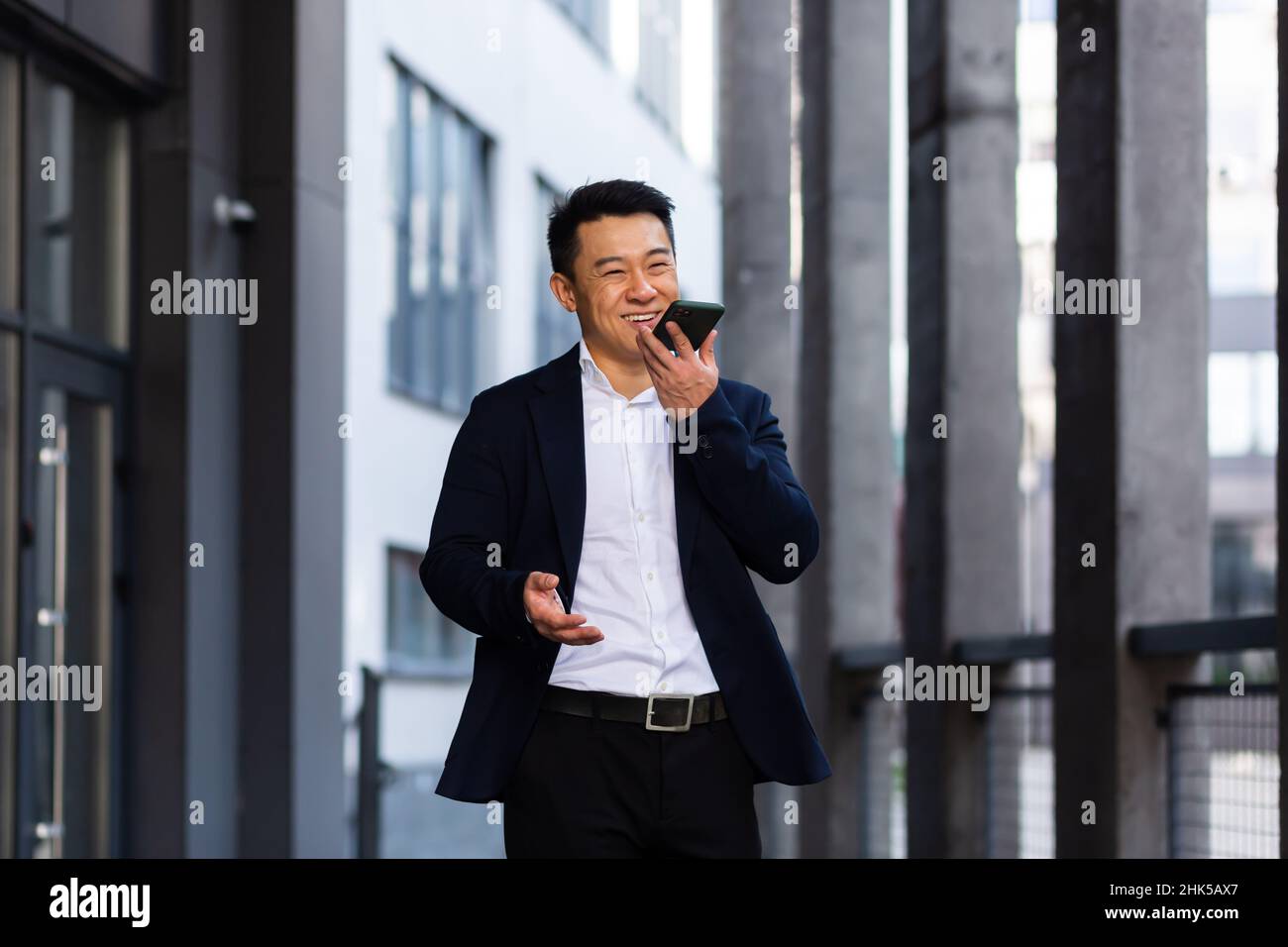 cheerful smiling Successful Asian businessman explains information to ...