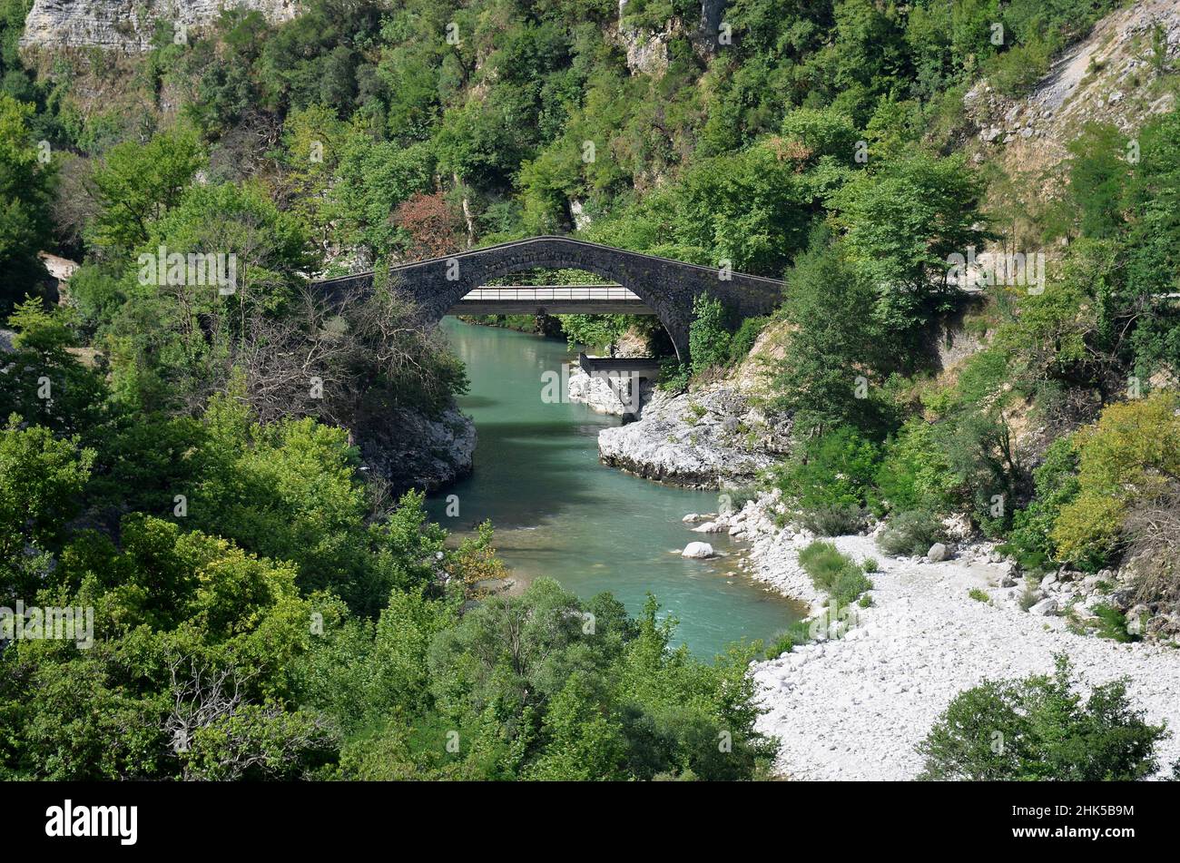 Greece, landscape with old and new bridge over Arachtos river in the ...