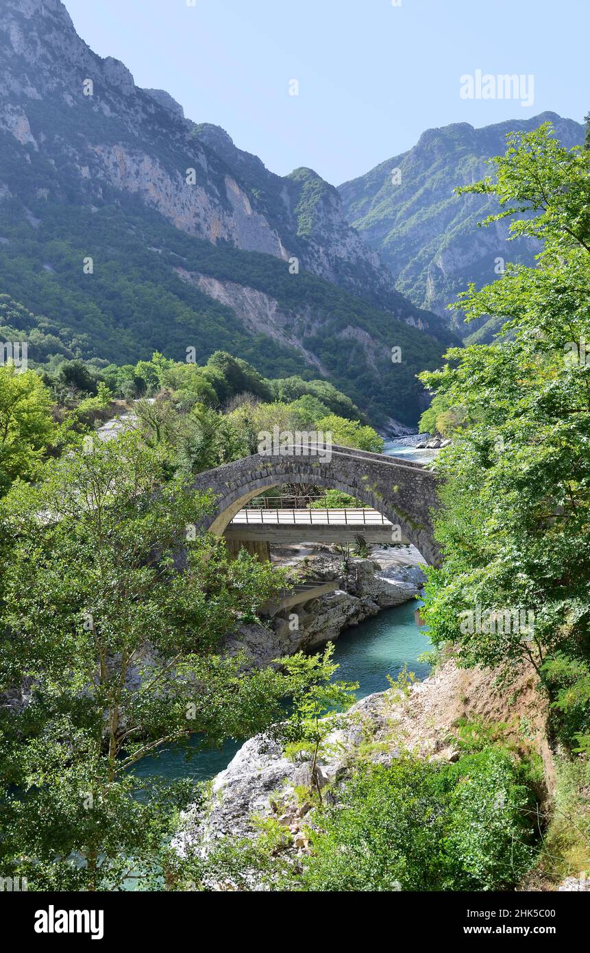 Greece, landscape with old and new bridge over Arachtos river in the ...