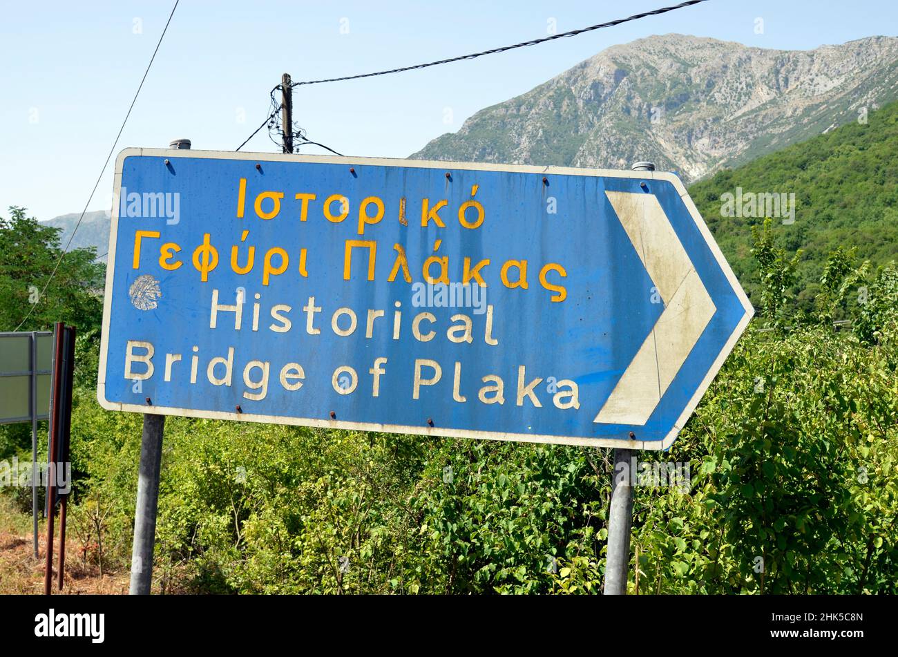 Greece, Epirus, direction sign to arch stone bridge of Plaka over ...