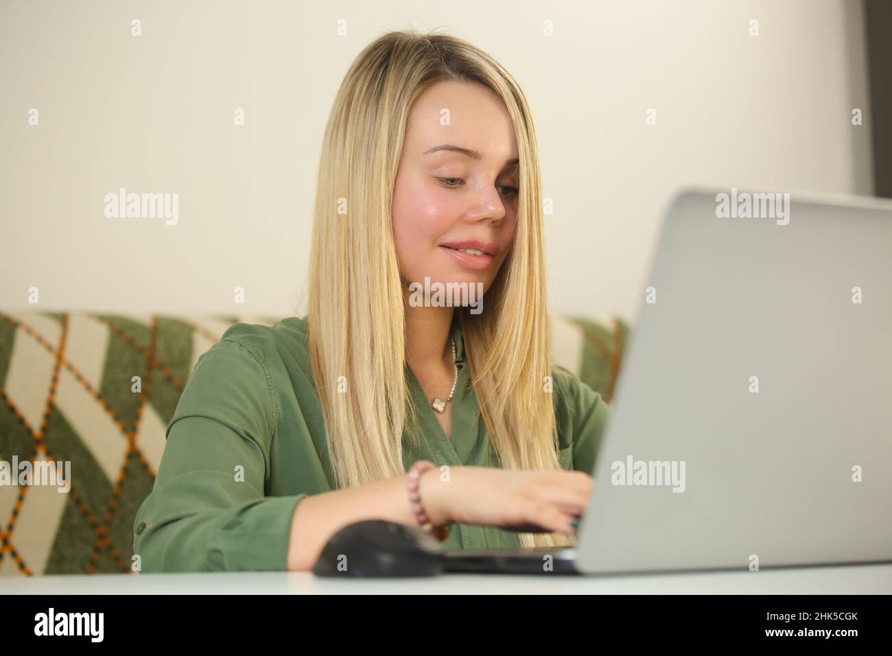 Domestic abuse victim woman working freelance on laptop computer ...