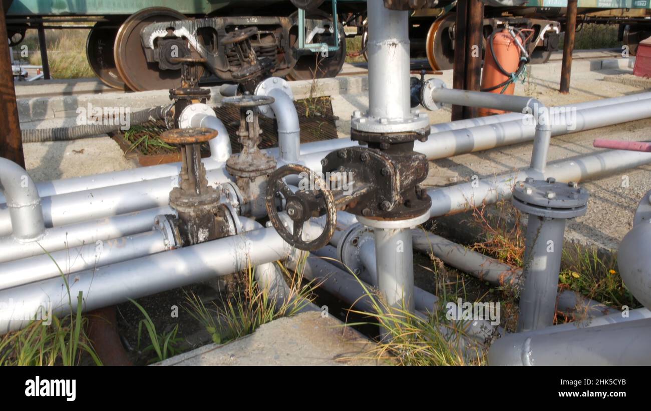 Old fuel transfer valves on a building in the industrial area. Stock ...