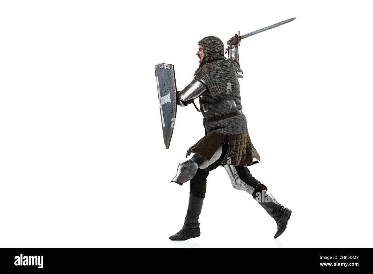 Portrait of concentrated man, medieval warrior in chain armor with ...