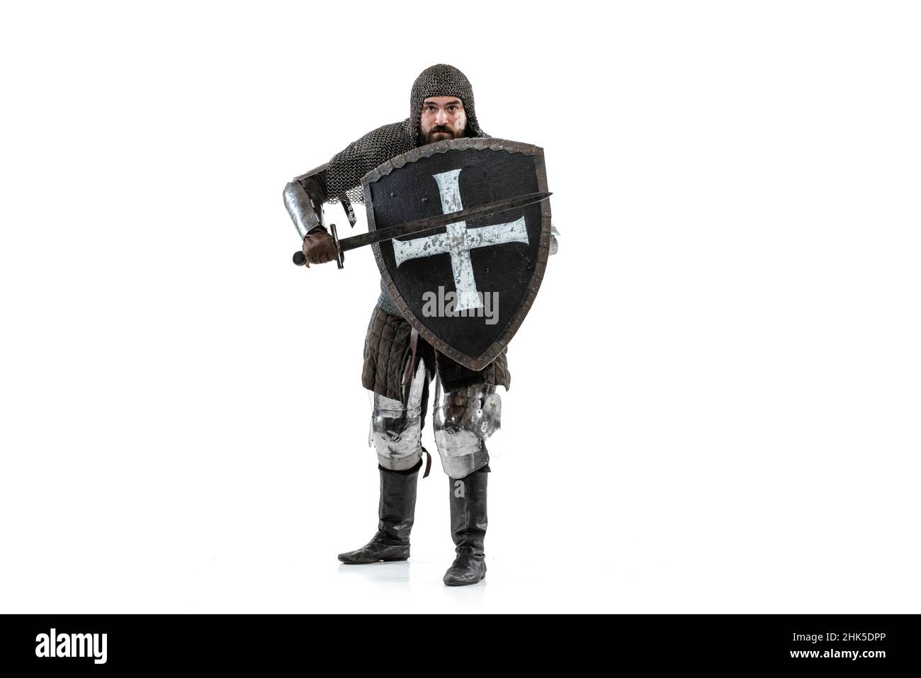 Portrait of fearless warrior chain mail with sword and shield ready to ...