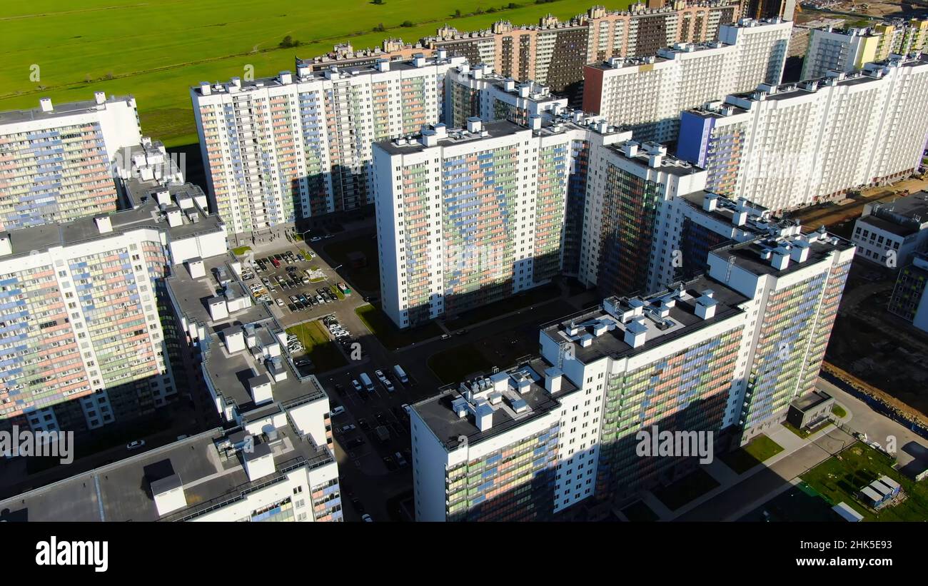 Top view of multi-colored facade of multi-storey residential building ...