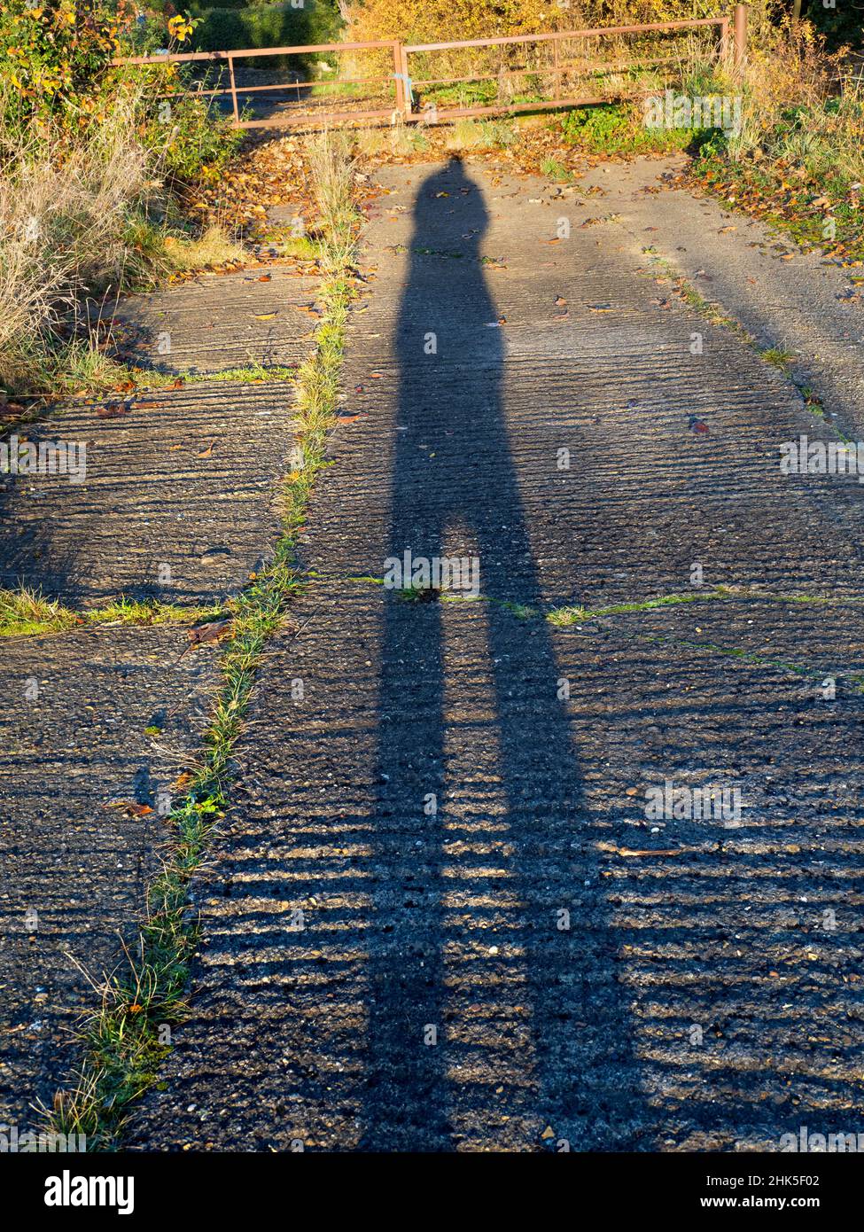 My shadow, on a footpath in Radley Village at sunrise 2 Stock Photo - Alamy