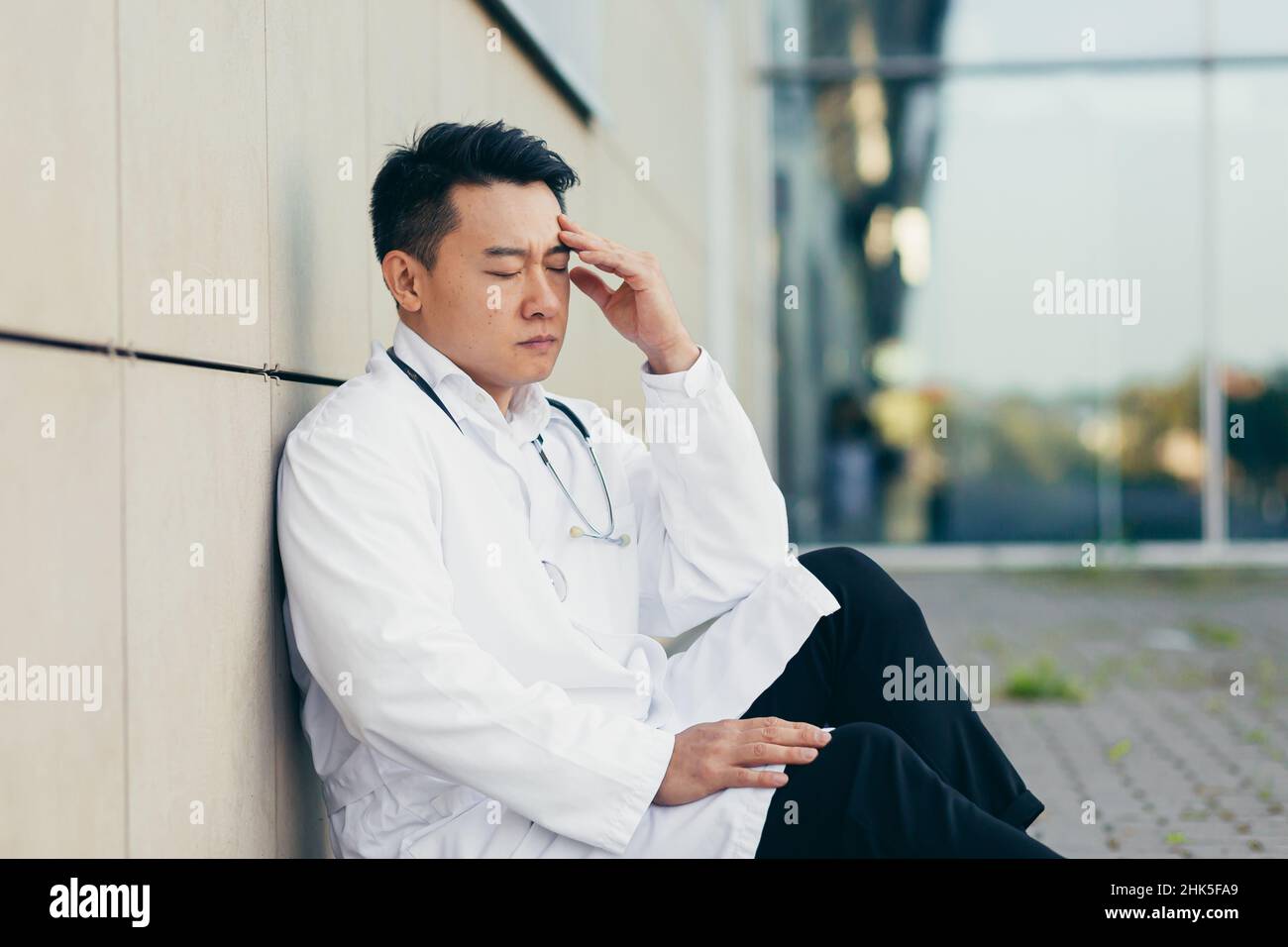 Sad surgeon sitting on floor hi-res stock photography and images - Alamy