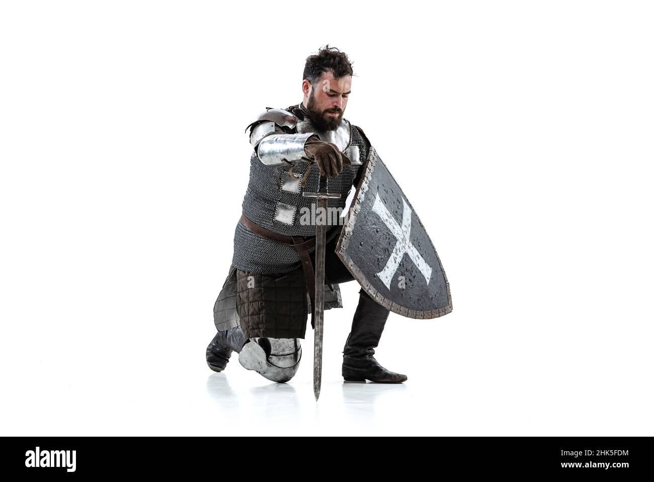 Portrait of serious manm medieval warrior, knight in special protective ...