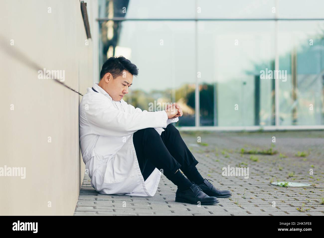Sad surgeon sitting on floor hi-res stock photography and images - Alamy