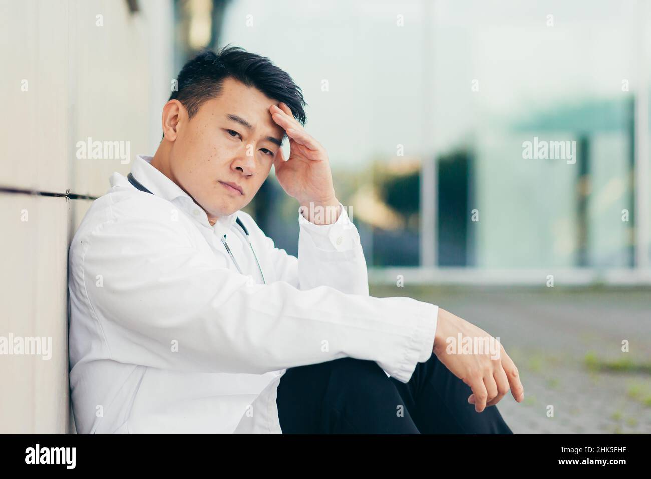Sad surgeon sitting on floor hi-res stock photography and images - Alamy