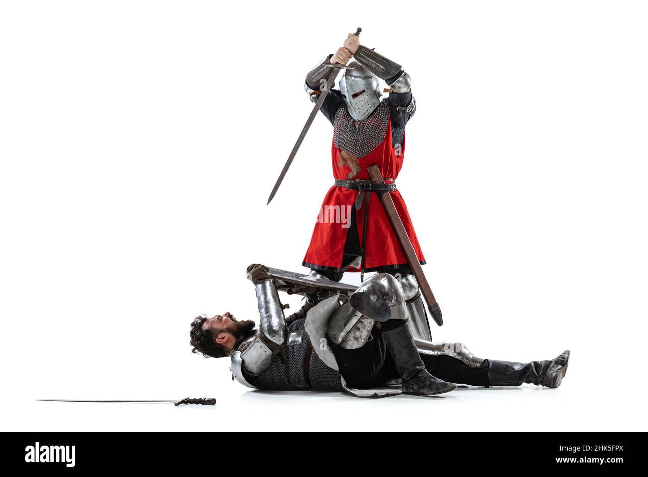 Full-length portrait of two medieval warriors, knights fighting ...