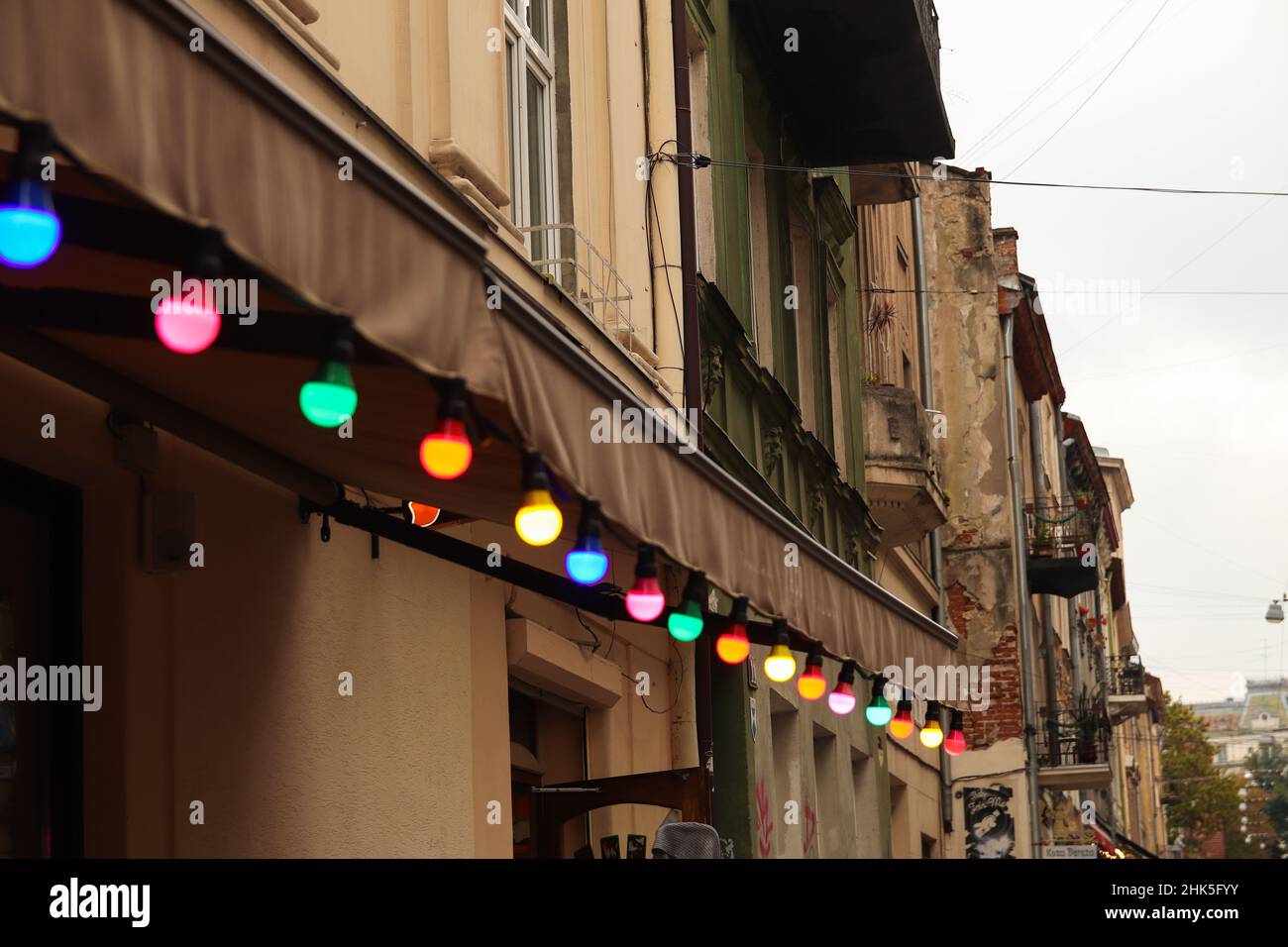 Colorful light bulbs. Classic architecture details. Old facade with ...