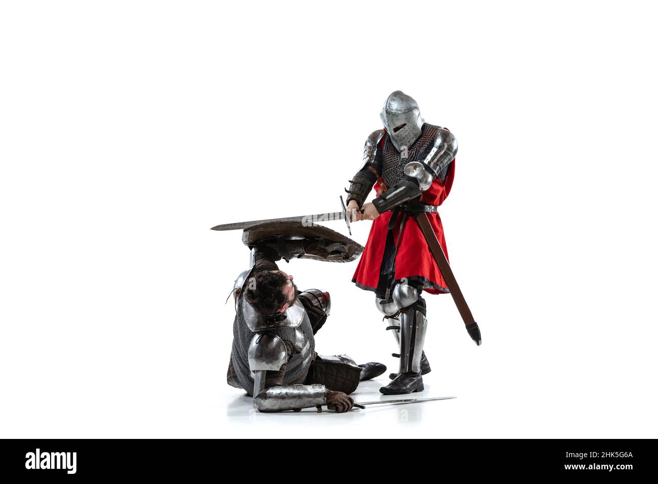 Full-length portrait of two medieval warriors, knights fighting ...