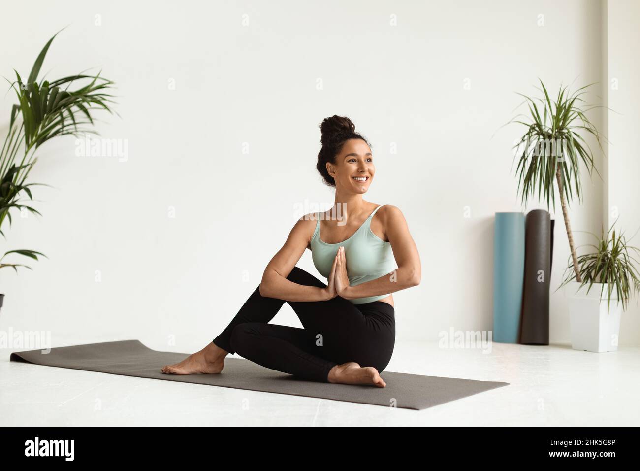 Young woman making yoga hi-res stock photography and images - Alamy