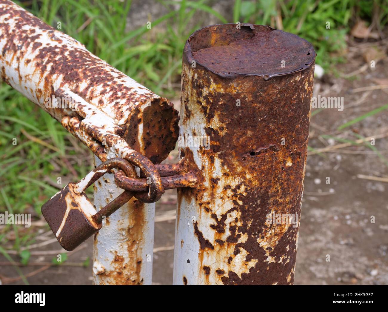 Rusty padlock hanging in the street alley Stock Photo - Alamy