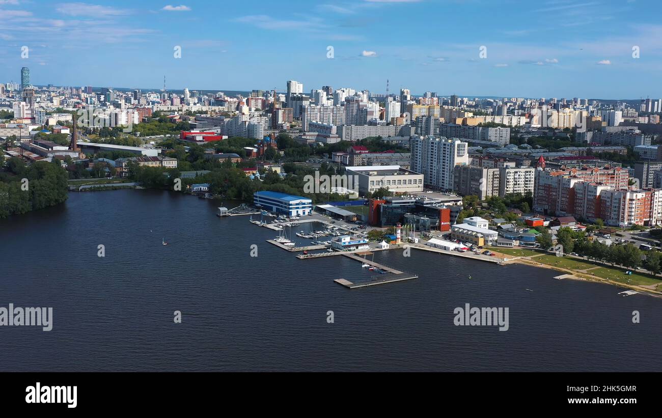 Aerial view of a big city pier. lake and green summer city on the ...