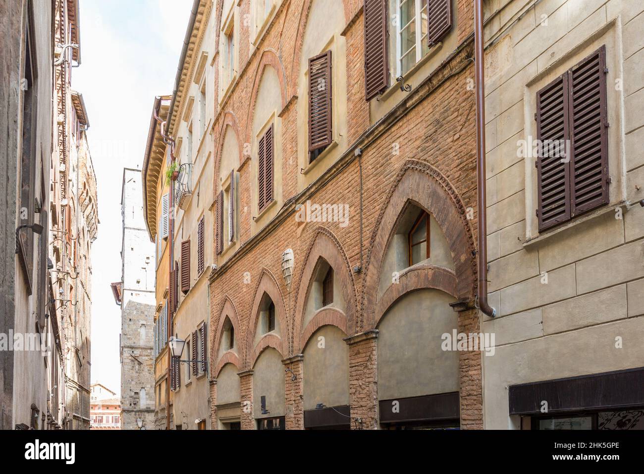 Building facades in an alley Stock Photo - Alamy