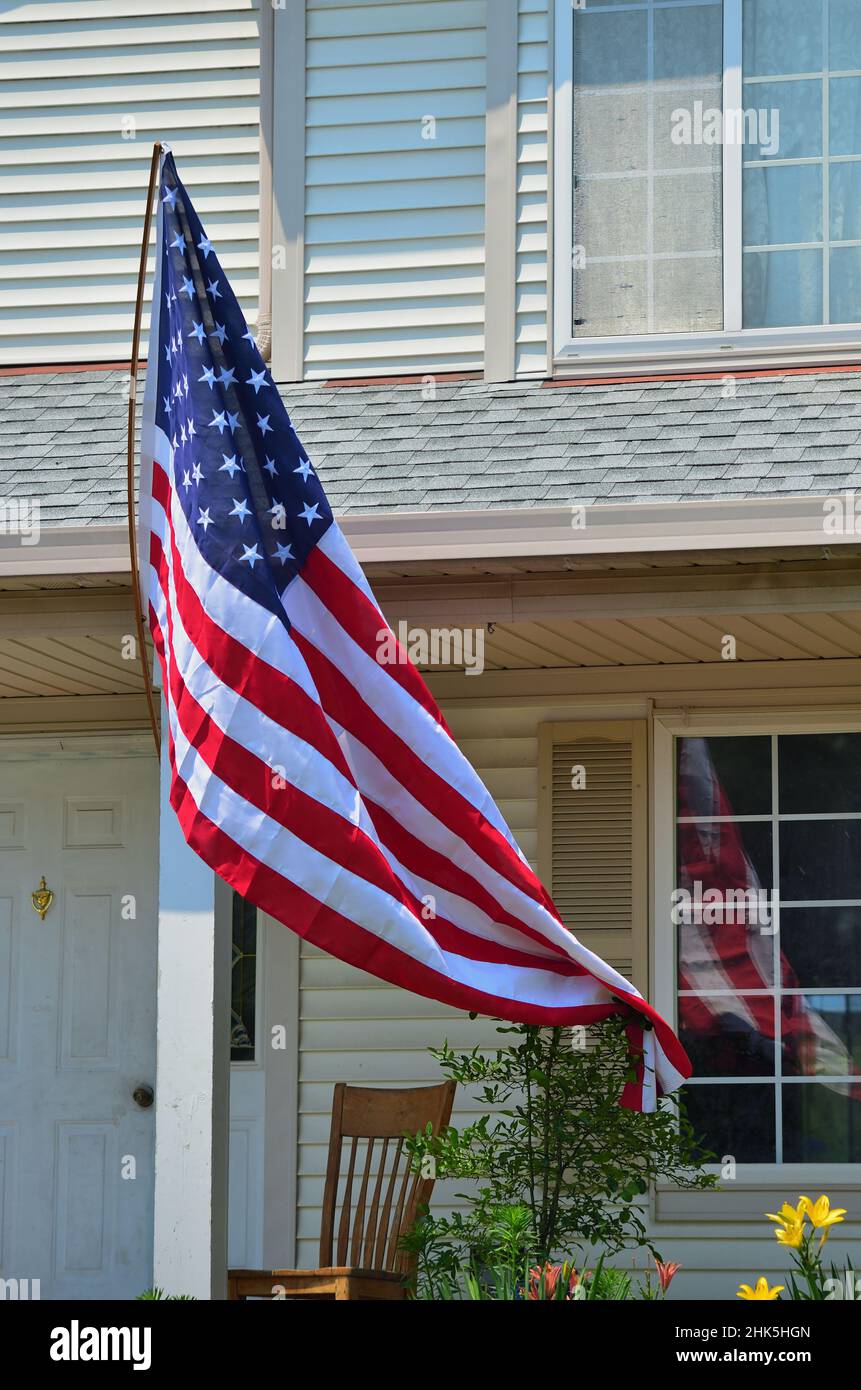 American flag front of house hi-res stock photography and images - Alamy