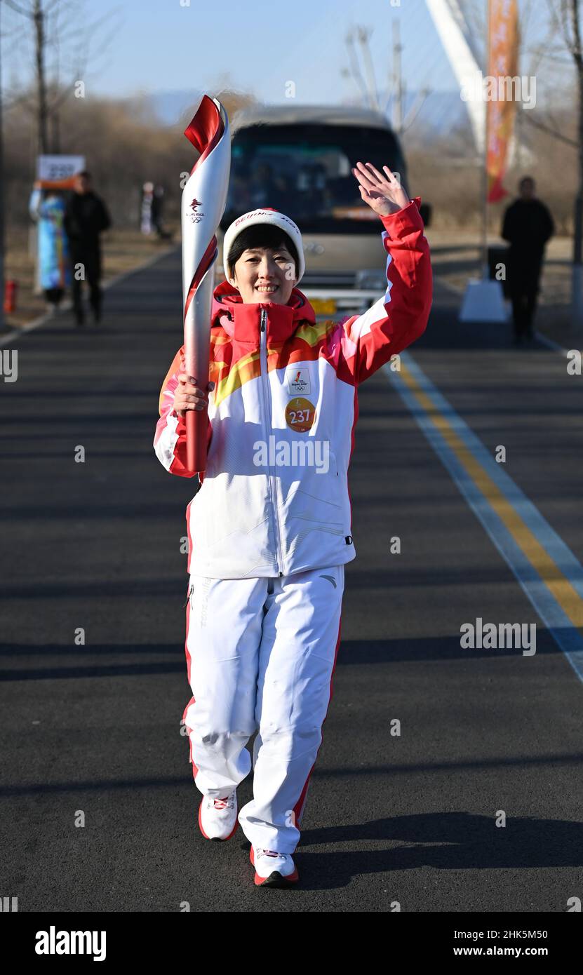 Beijing, China. 2nd Feb, 2022. Torch bearer Li Xiaomei runs with the torch during the Beijing ...