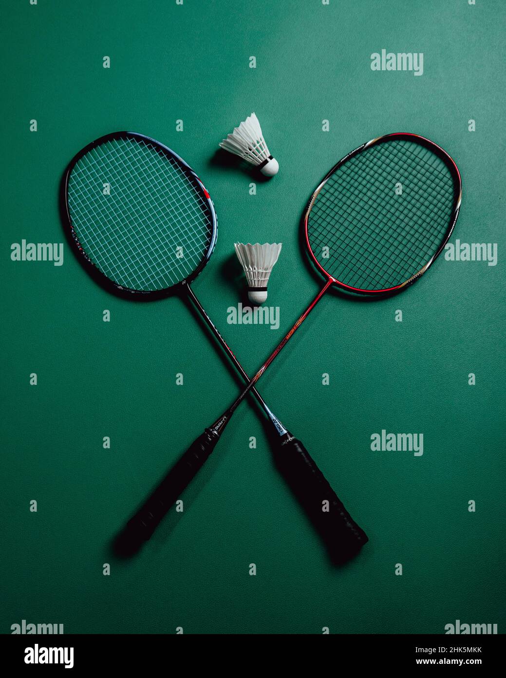 badminton rackets and cocks in the badminton court Stock Photo - Alamy