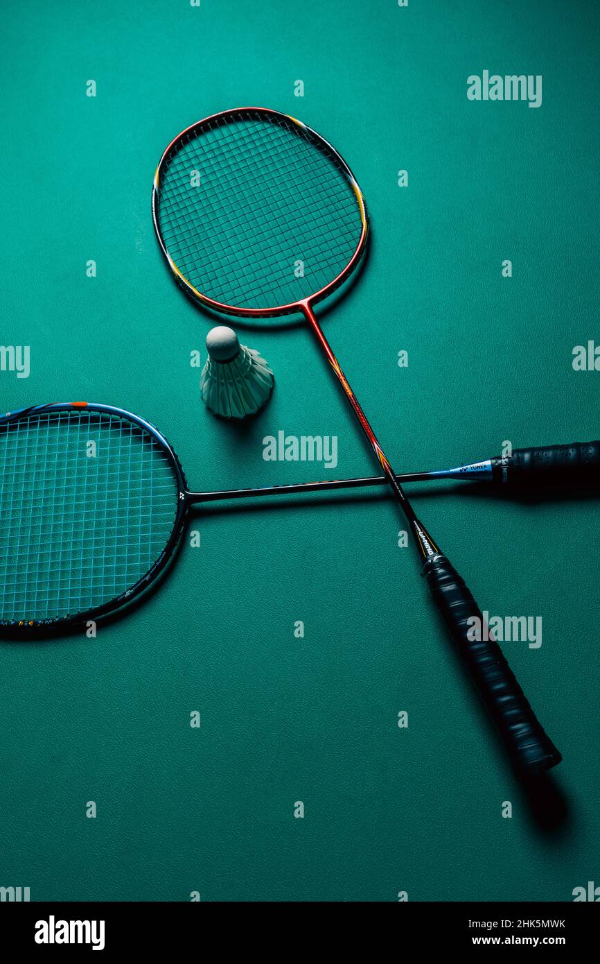 badminton rackets and cocks in the badminton court Stock Photo - Alamy