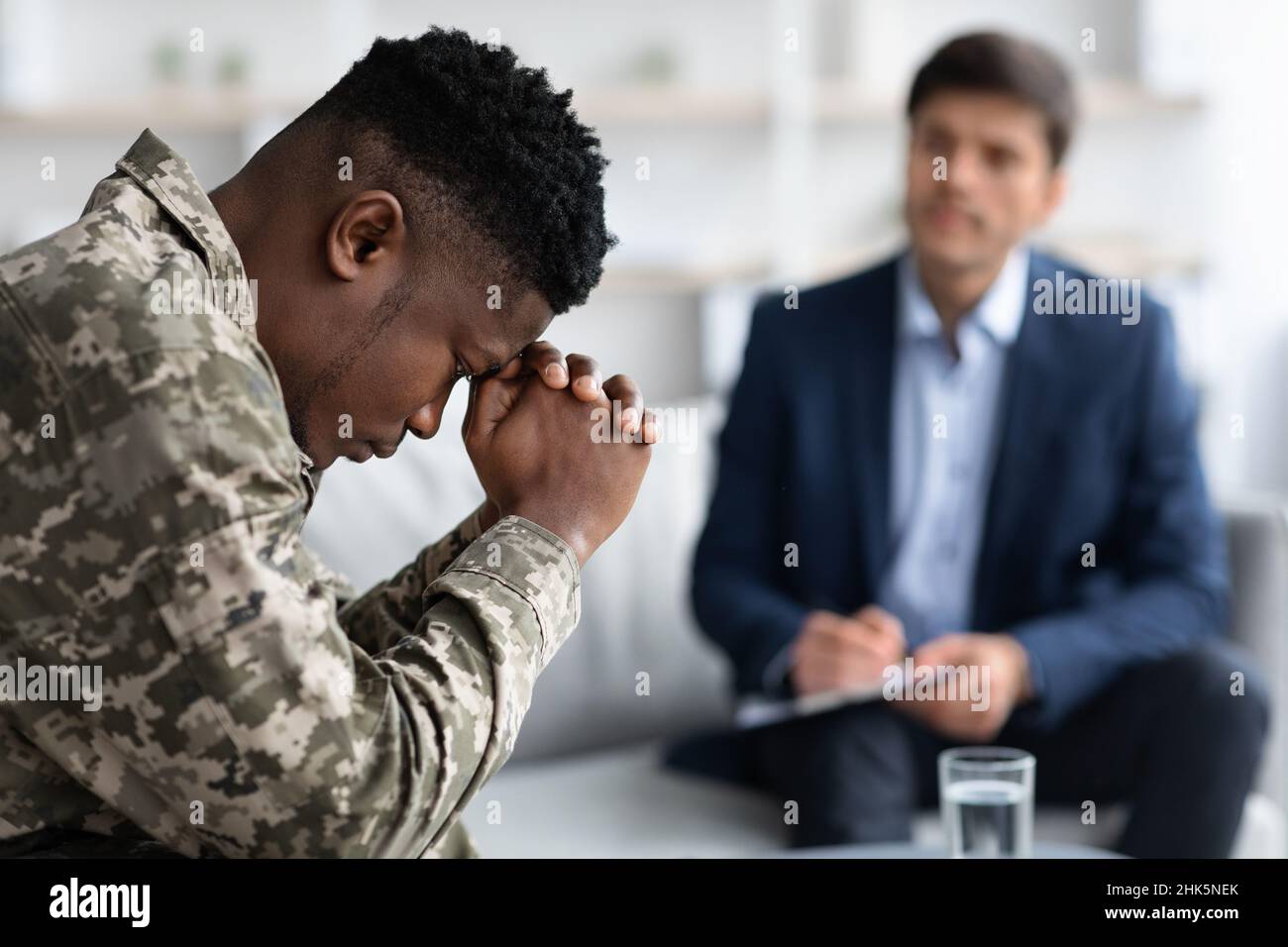 Depressed military guy attending therapy session with psychologist ...