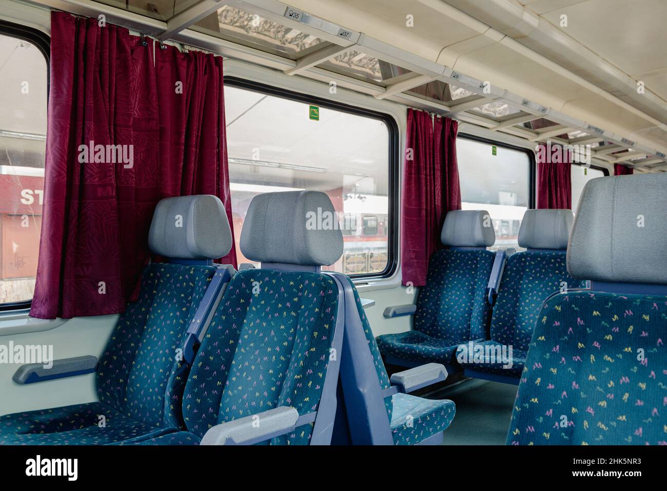 Inside the train with empty seats in Romania Stock Photo - Alamy