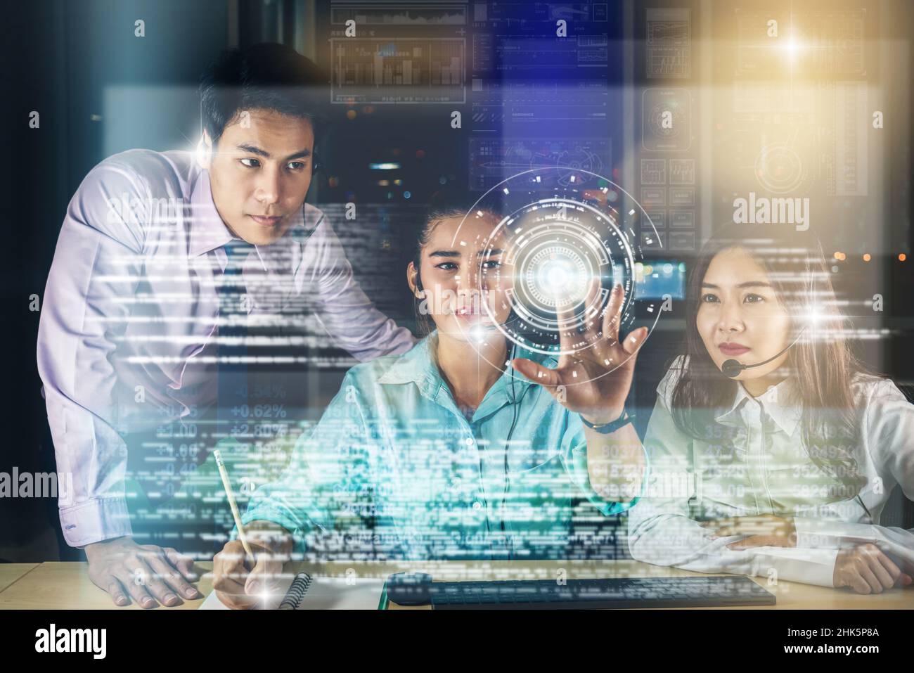 Group of business People working hard late with her technology computer ...