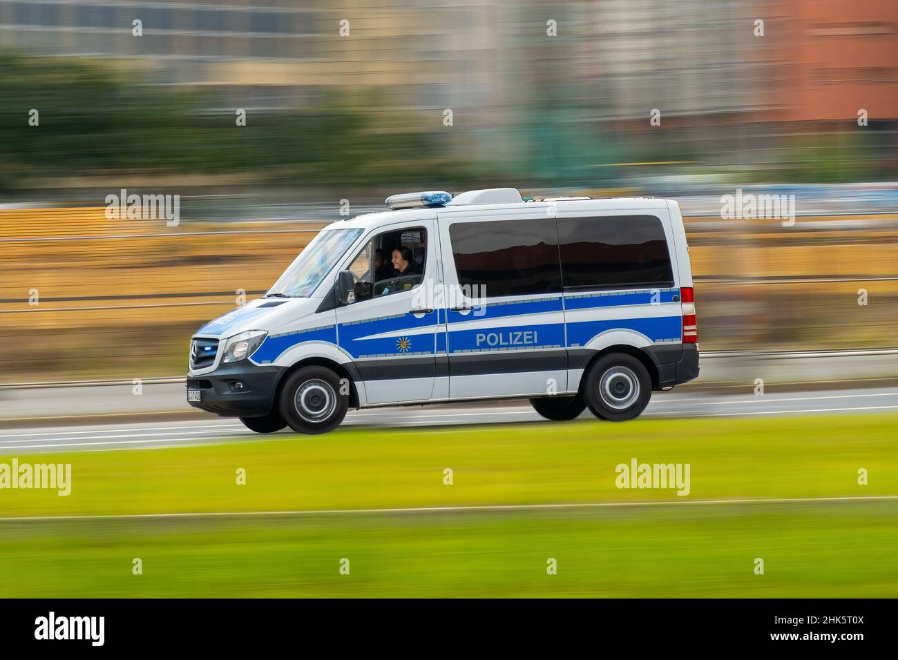 German police car with letters Polizei drives fast on call on the ...