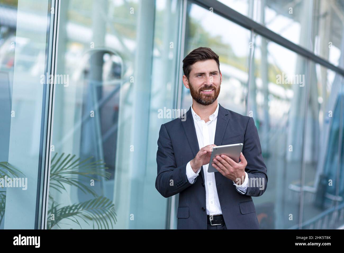 Cheerful successful businessman works outdoors hi-res stock photography ...