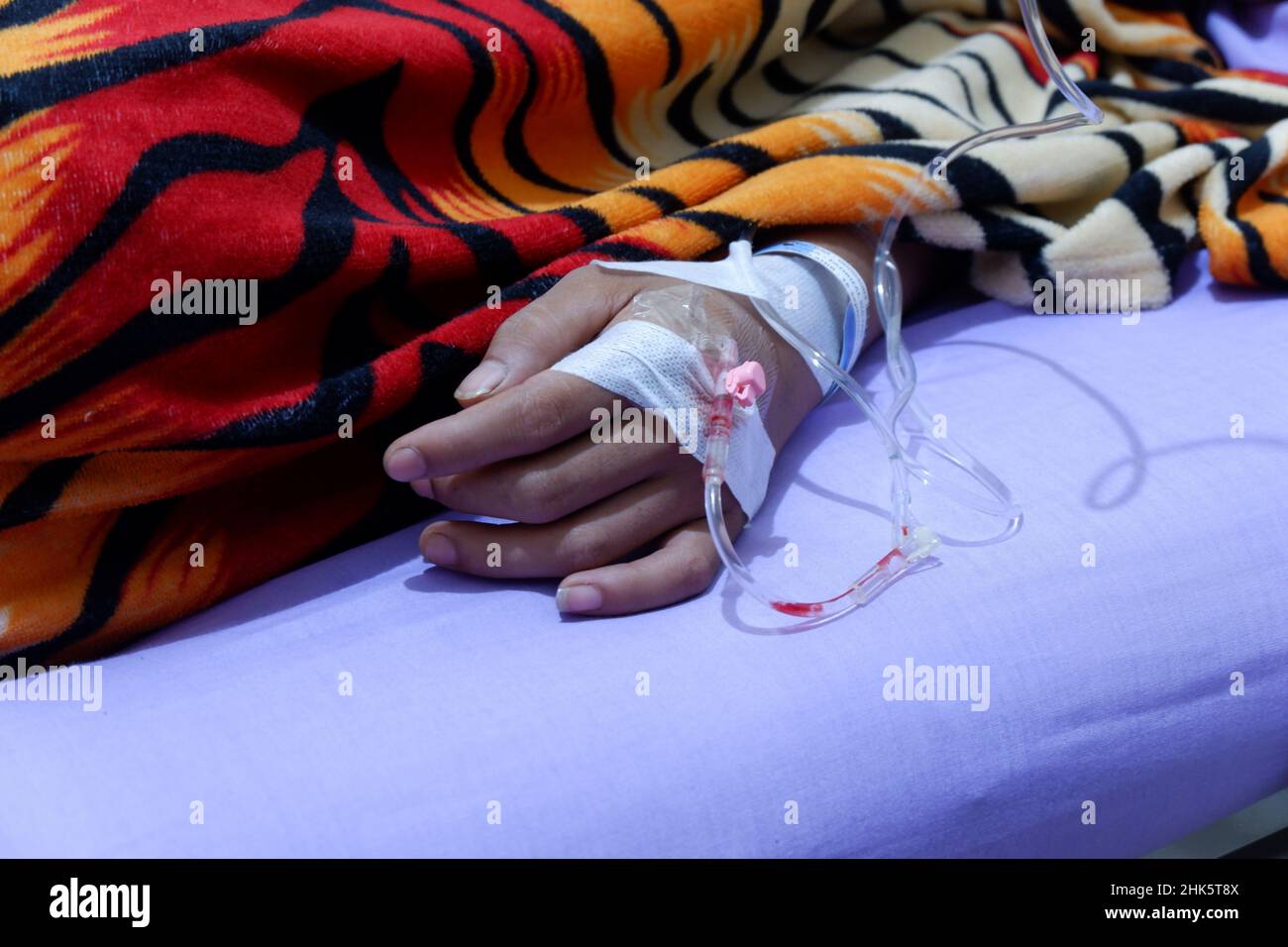 Close up hand of asian man patient with drip receiving for injection ...