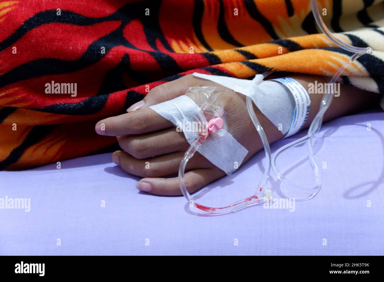 Close up hand of asian man patient with drip receiving for injection ...