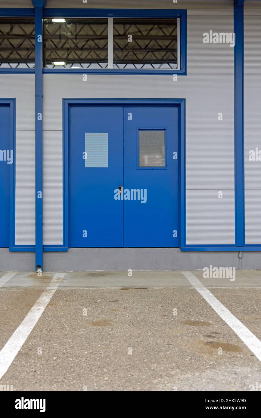 Closed Double Blue Doors at Distribution Warehouse Stock Photo - Alamy