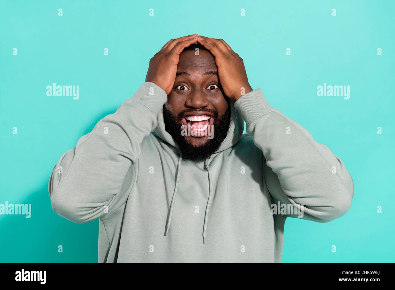 Portrait of attractive cheerful overwhelmed guy news reaction win ...