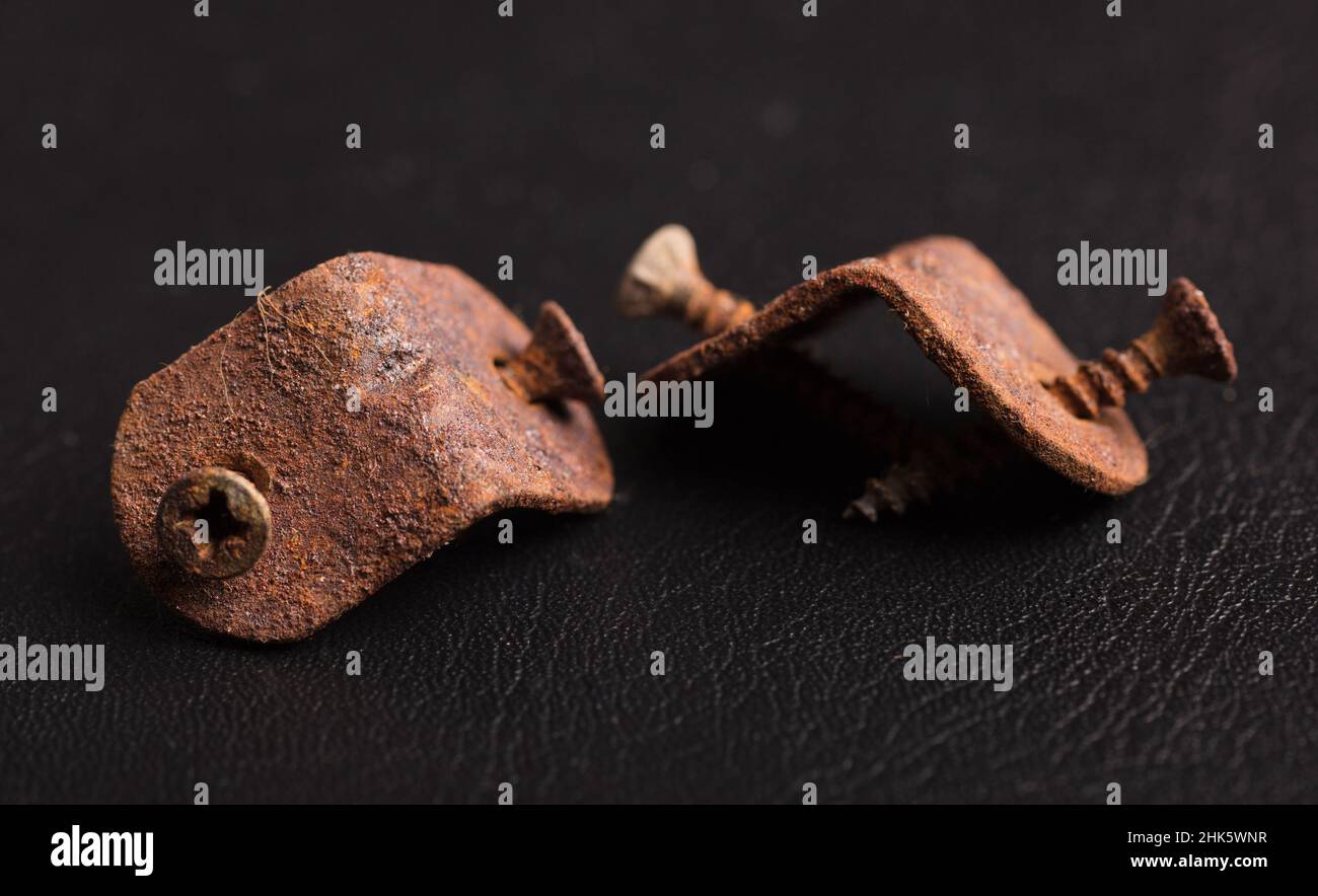 metal angle bracket with corrosive rust and deteriorated screws,oxide ...