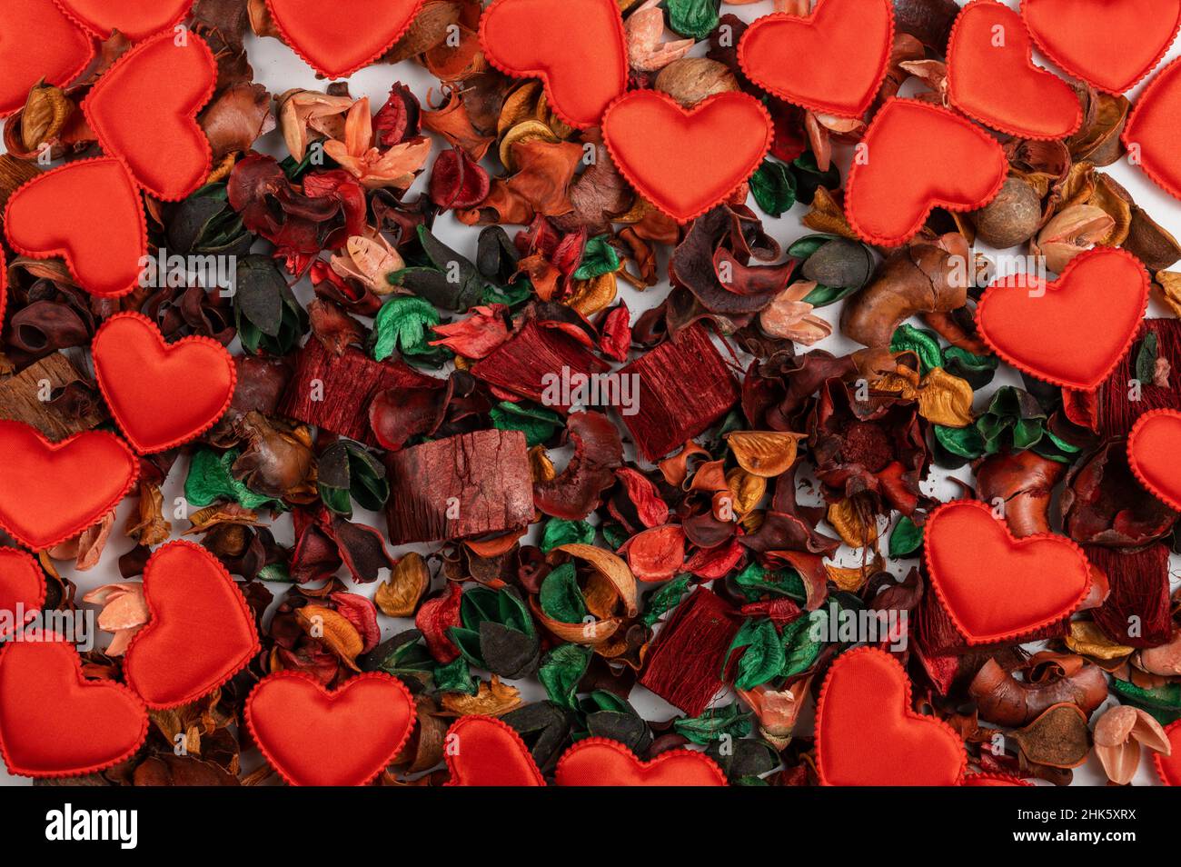 Different dry flowers with red hearts background. Valentines day or ...