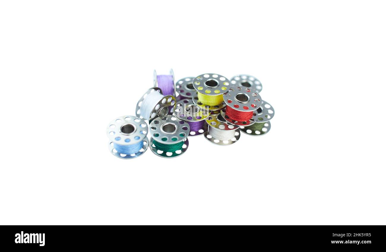 Colorful bobbins for machine sewing isolated on white background ...