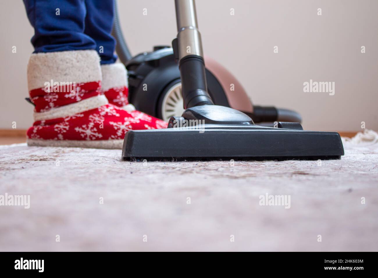 Woman using vacuum cleaner hi-res stock photography and images - Alamy