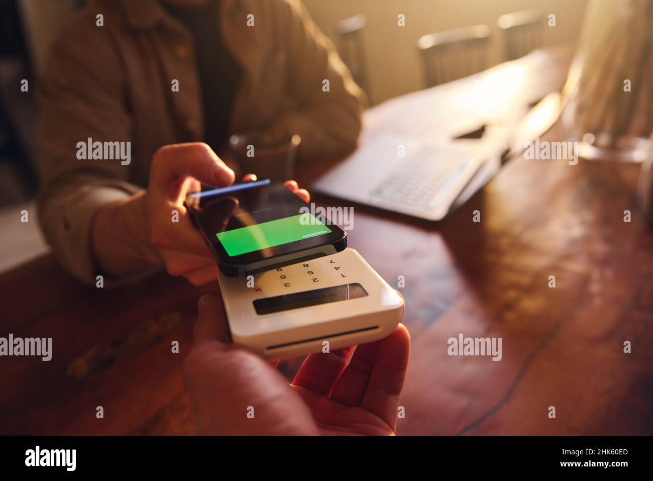 Hand using mobile payment to pay for coffee in coffee shop Stock Photo ...