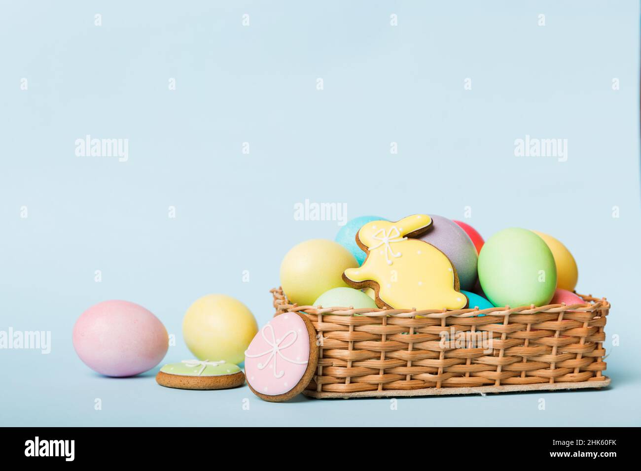 Colorful easter cookies in basket with Multi colors Easter eggs on ...