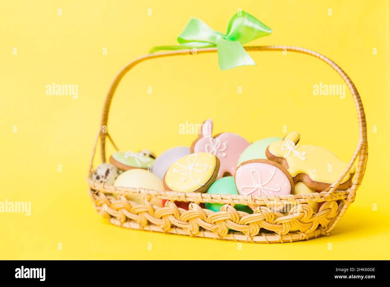 Colorful easter cookies in basket with Multi colors Easter eggs on ...