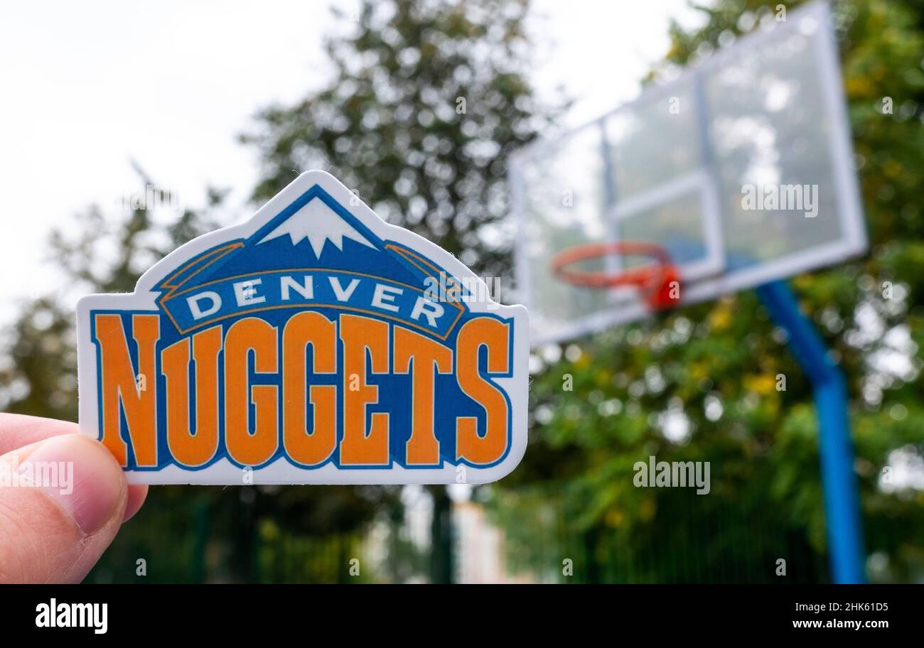 September 15, 2021, Denver, USA, A man holds the emblem of the Denver ...
