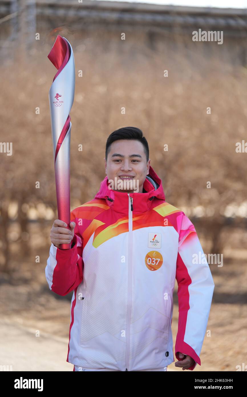 Beijing, China. 2nd Feb, 2022. Torch bearer Xu Jiang runs with the torch during the Beijing 2022 ...