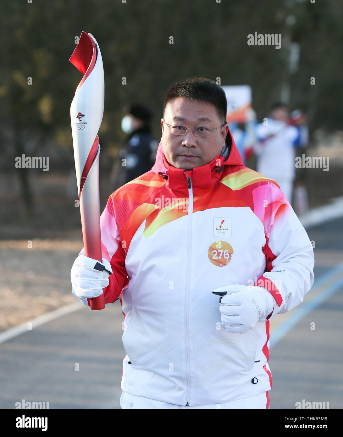 Beijing, China. 2nd Feb, 2022. Torch bearer Han Sen runs with the torch ...
