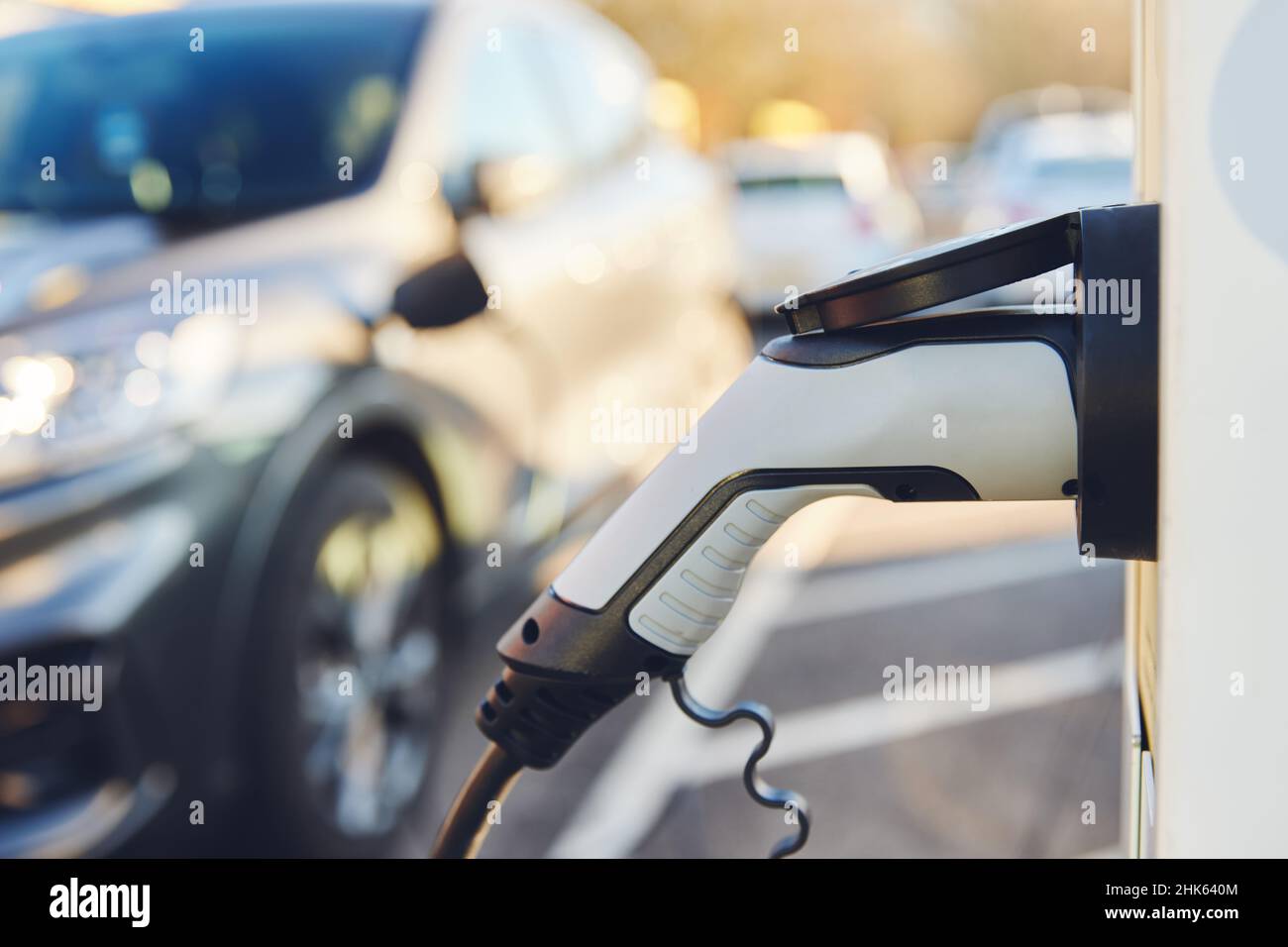 Electric Car Charging Point with electric car behind Stock Photo - Alamy