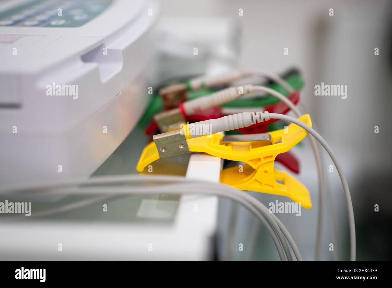 ECG concept. Woman doctor cardiologist doing electrocardiogram test to ...