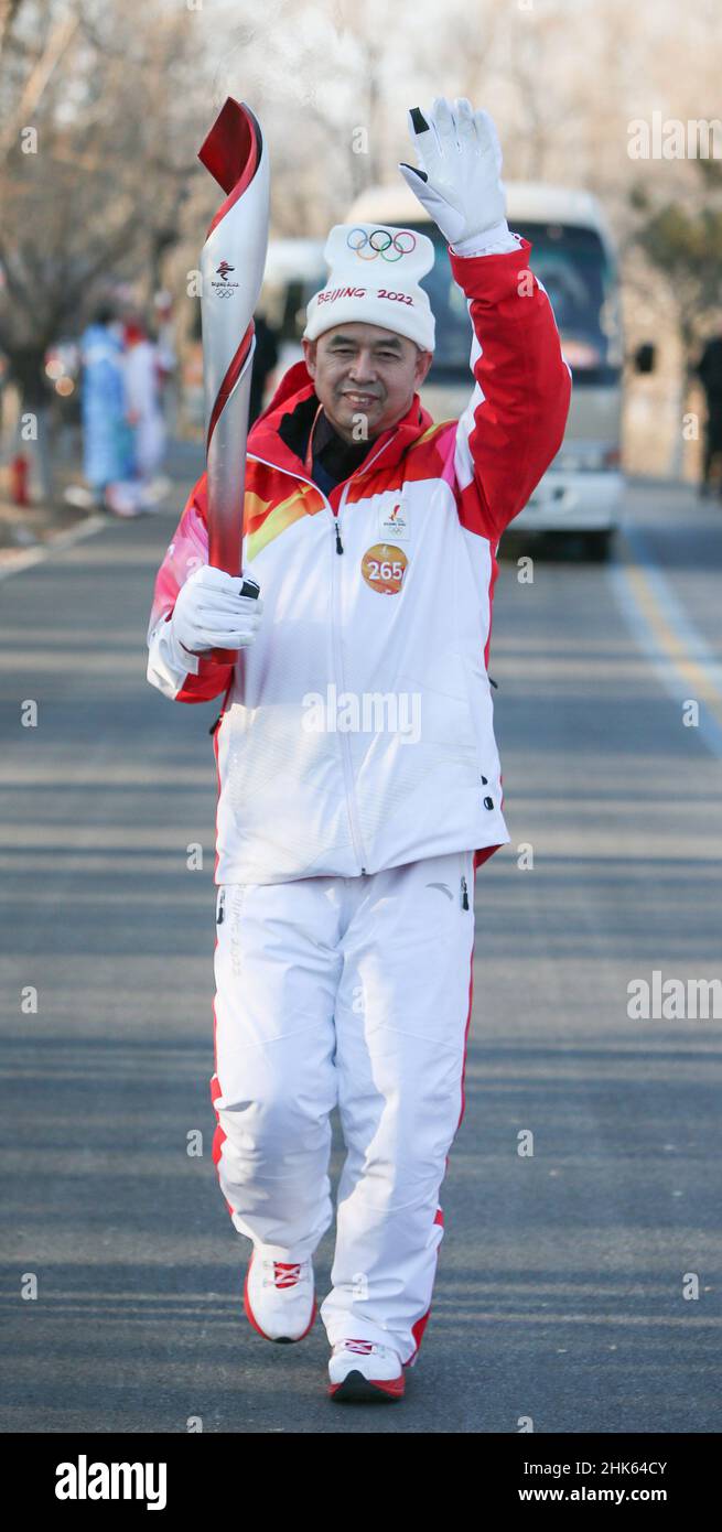 Beijing, China. 2nd Feb, 2022. Torch bearer Dong Rui runs with the ...