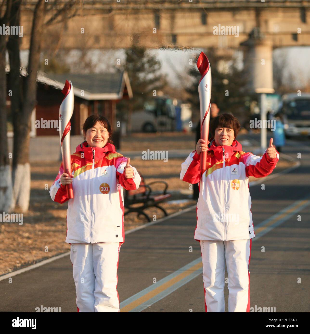 Beijing, China. 2nd Feb, 2022. Torch bearers Li Deqing (R) and Li ...